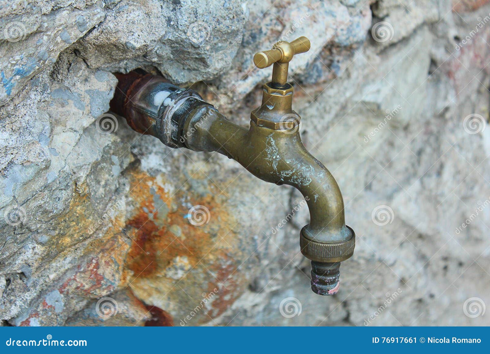 Tap stuck in the rocks stock image. Image of valve, potable - 76917661