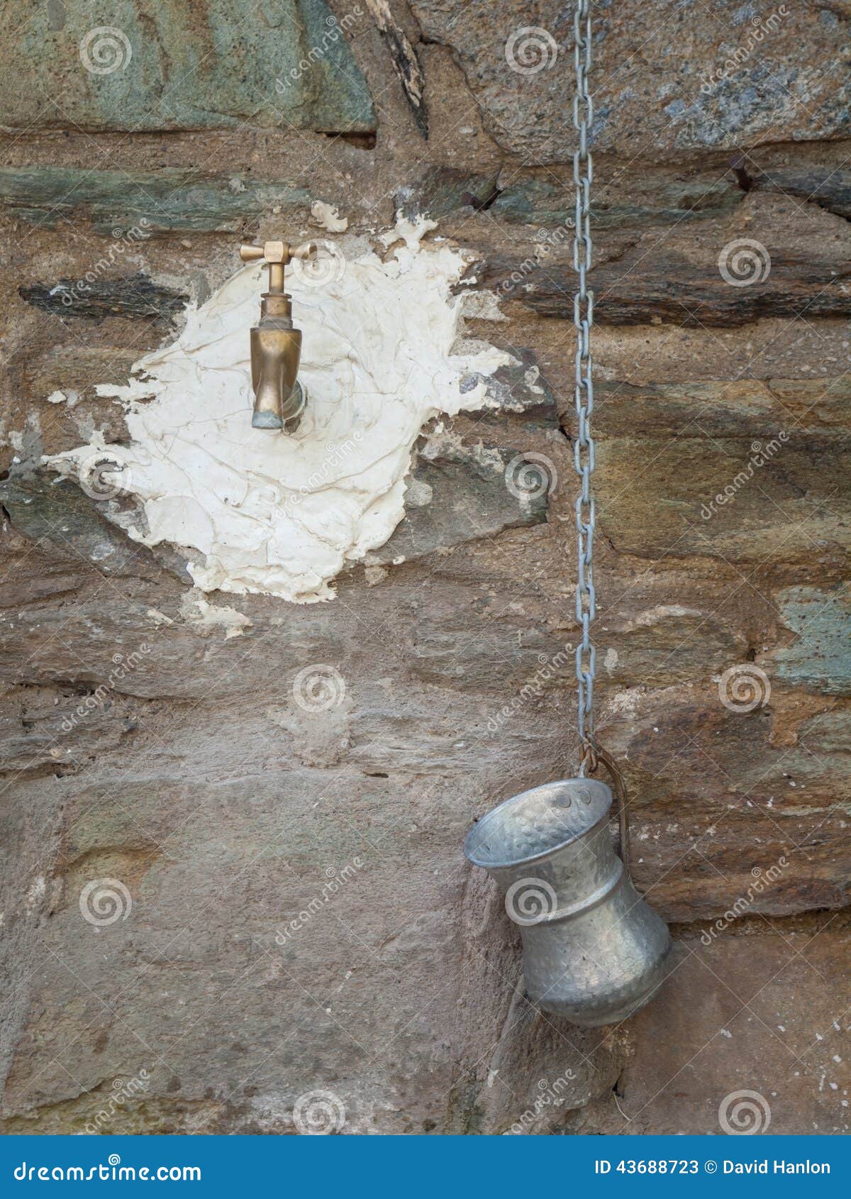 Tap in Wall with Drinking Cup Stock Image - Image of drinking, stone ...