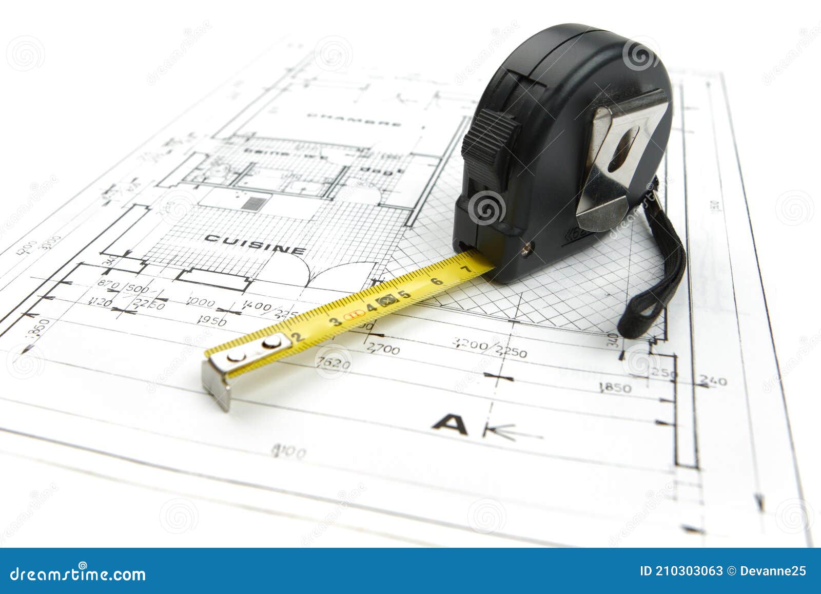 Tape Measure in Close Up on Blueprint Isolated on a White Background ...