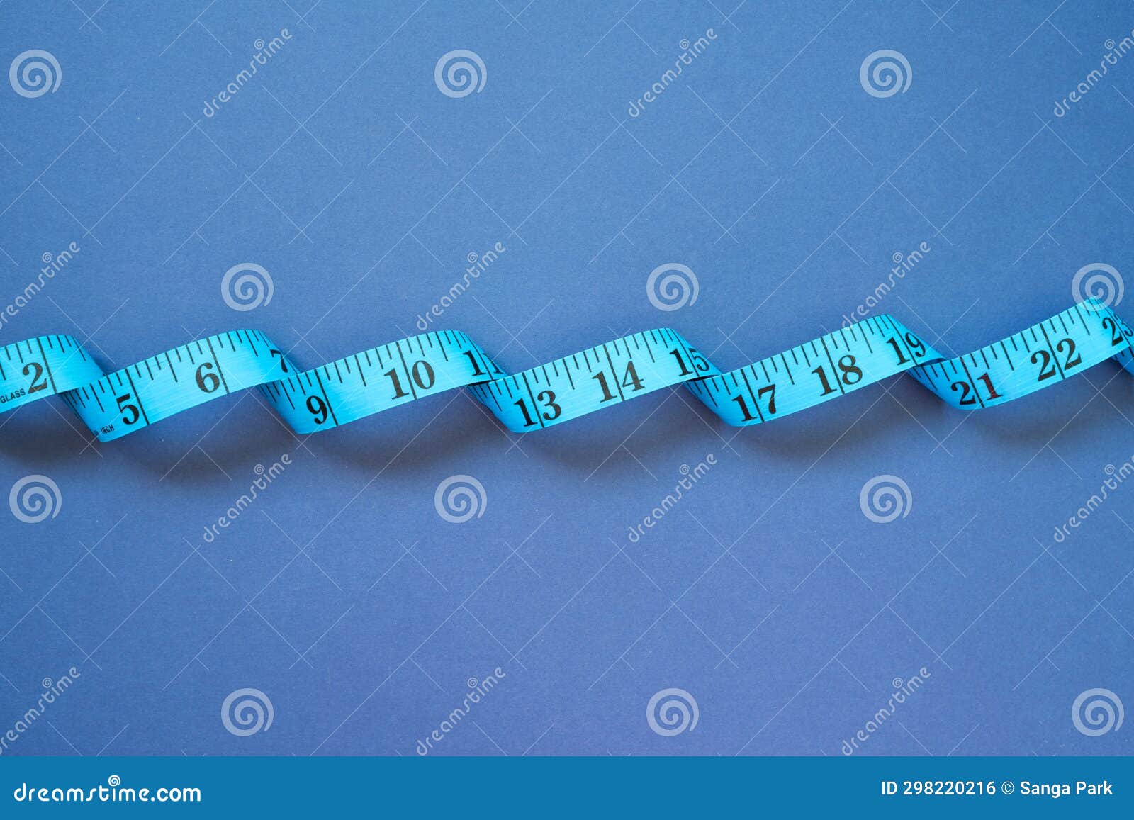 Tape Measure on Navy Blue Background. Top View Stock Photo - Image of ...