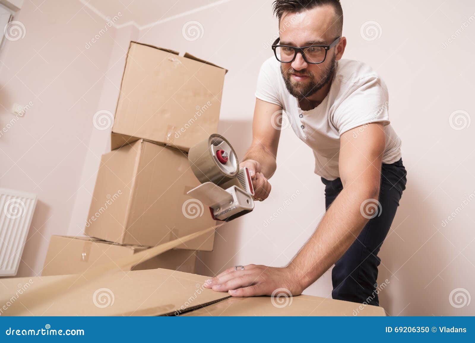 Taping boxes stock photo. Image of handsome, cardboard - 69206350