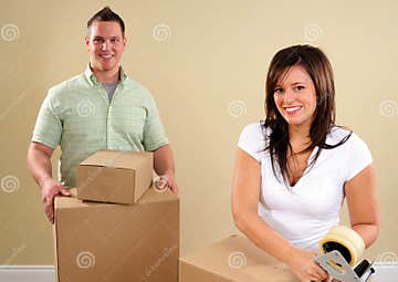 Taping Up Boxes stock photo. Image of beautiful, couple - 5343950