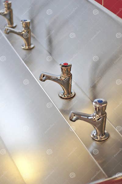 Taps in a row stock photo. Image of steel, restroom, multiple - 1591924