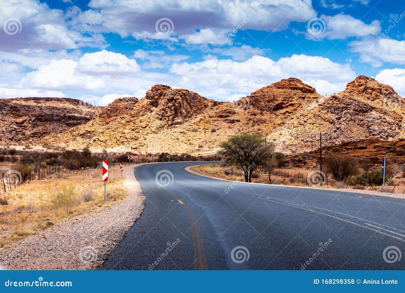 Tar Road through a Rocky Desert Stock Photo - Image of clouds, desert ...