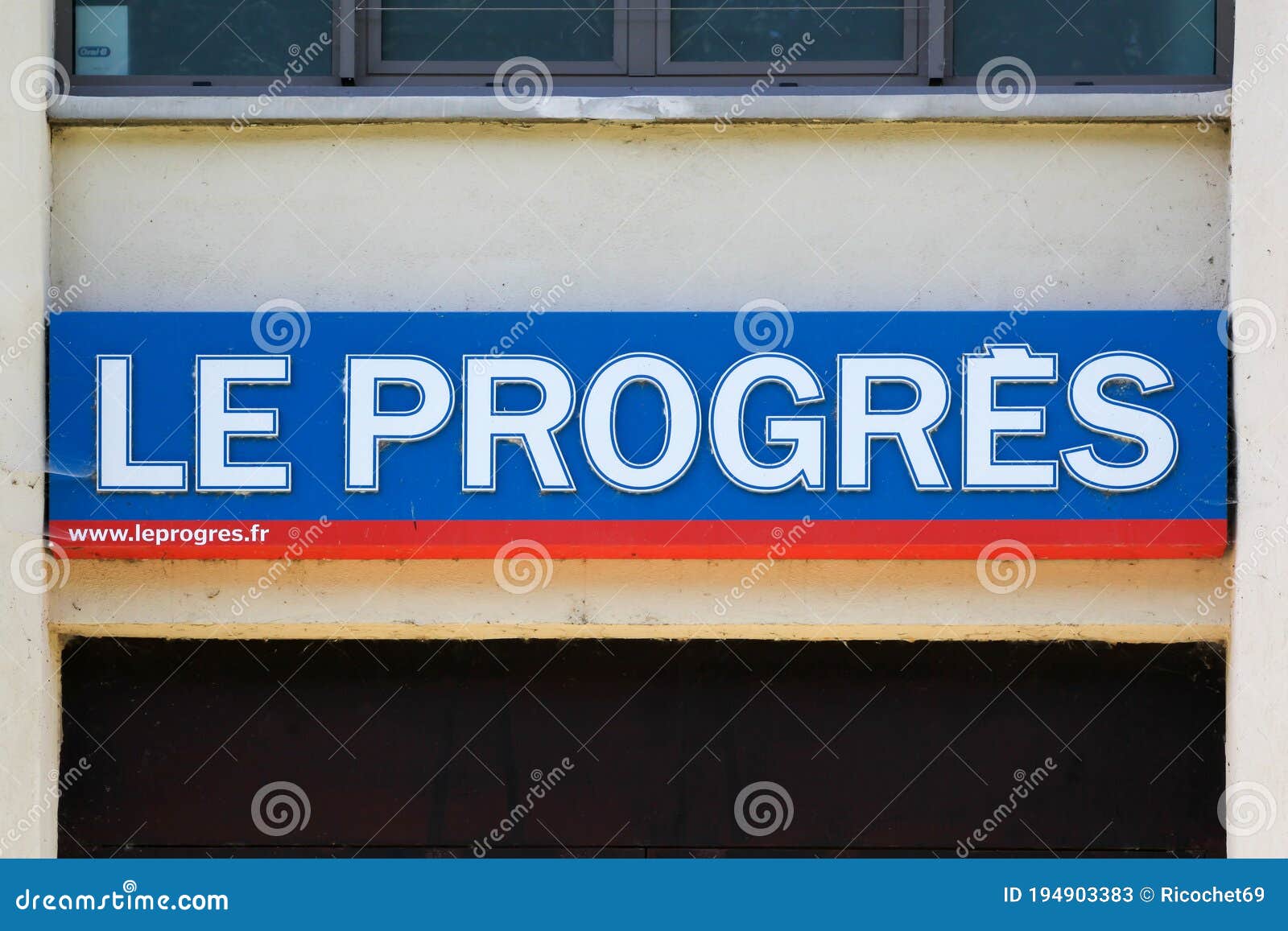 Le Progres logo on a wall editorial stock photo. Image of france ...