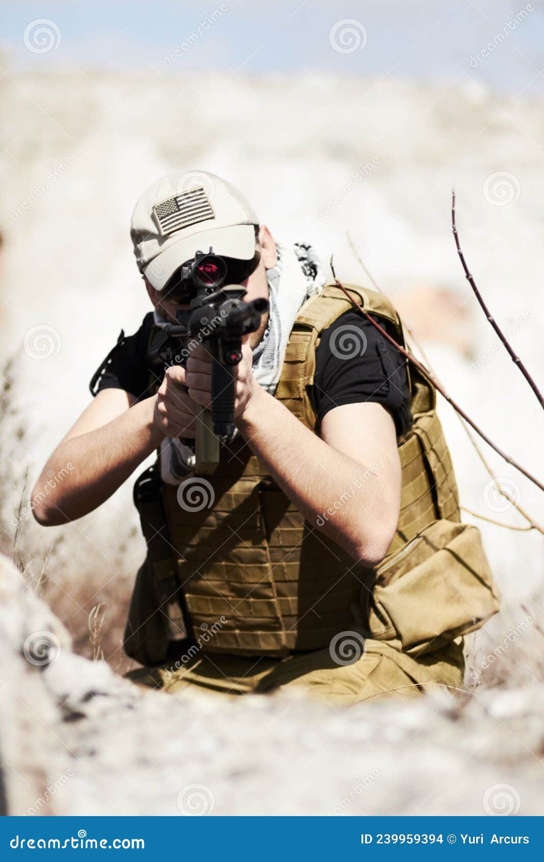 Target Training. a Soldier Crouched Down and Pointing His Gun at the ...