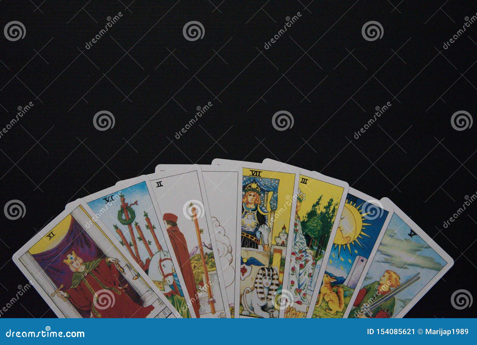 Tarot Cards on a Black Surface - Horizontal Stock Image - Image of ...