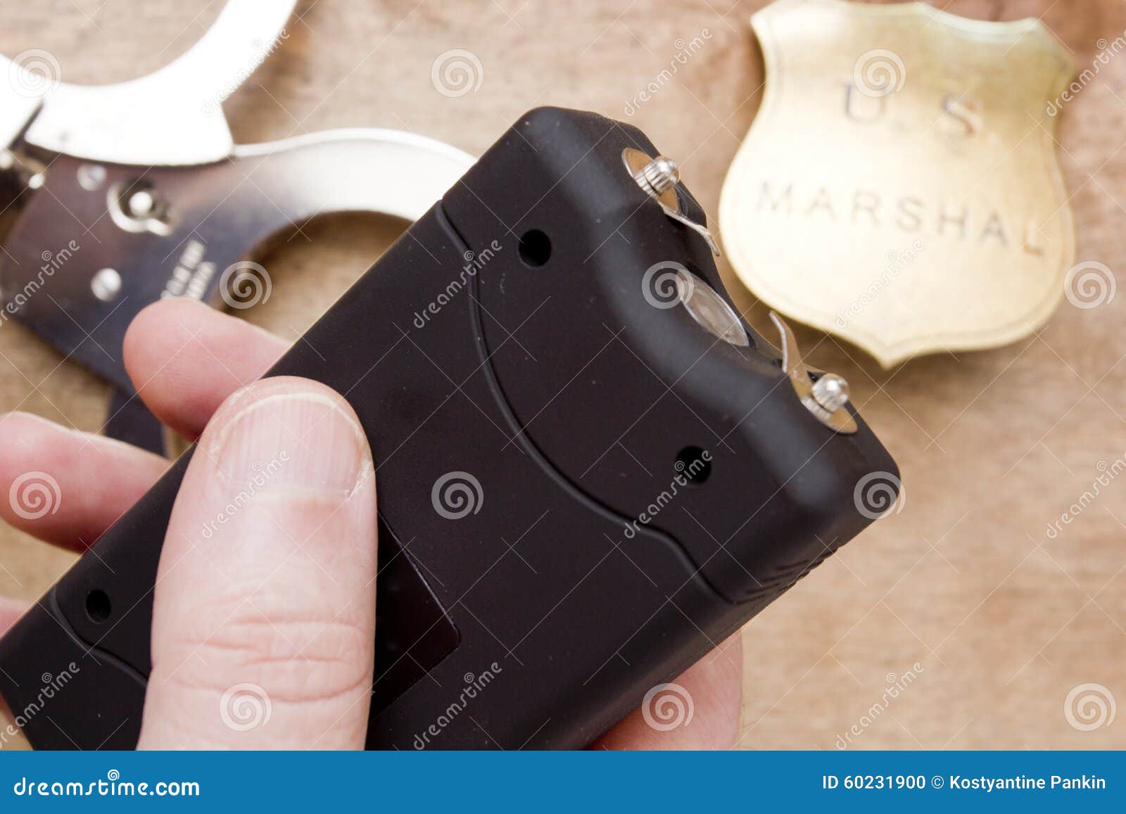 Taser in hand men stock photo. Image of sport, self, strong - 60231900