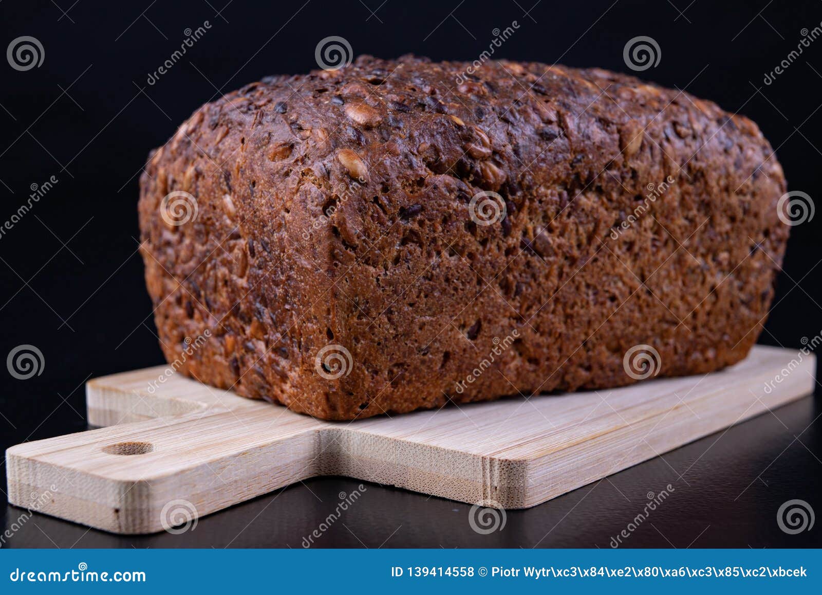Tasting Bread with Seeds on a Wooden Board. Fresh Dark Bread on the ...