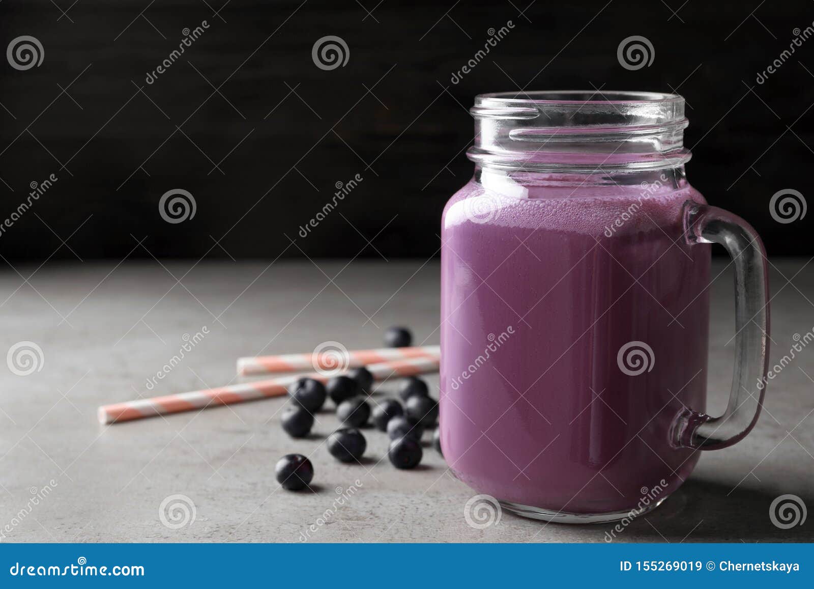 Tasty Acai Drink in Mason Jar and Berries on Grey Table Stock Image ...