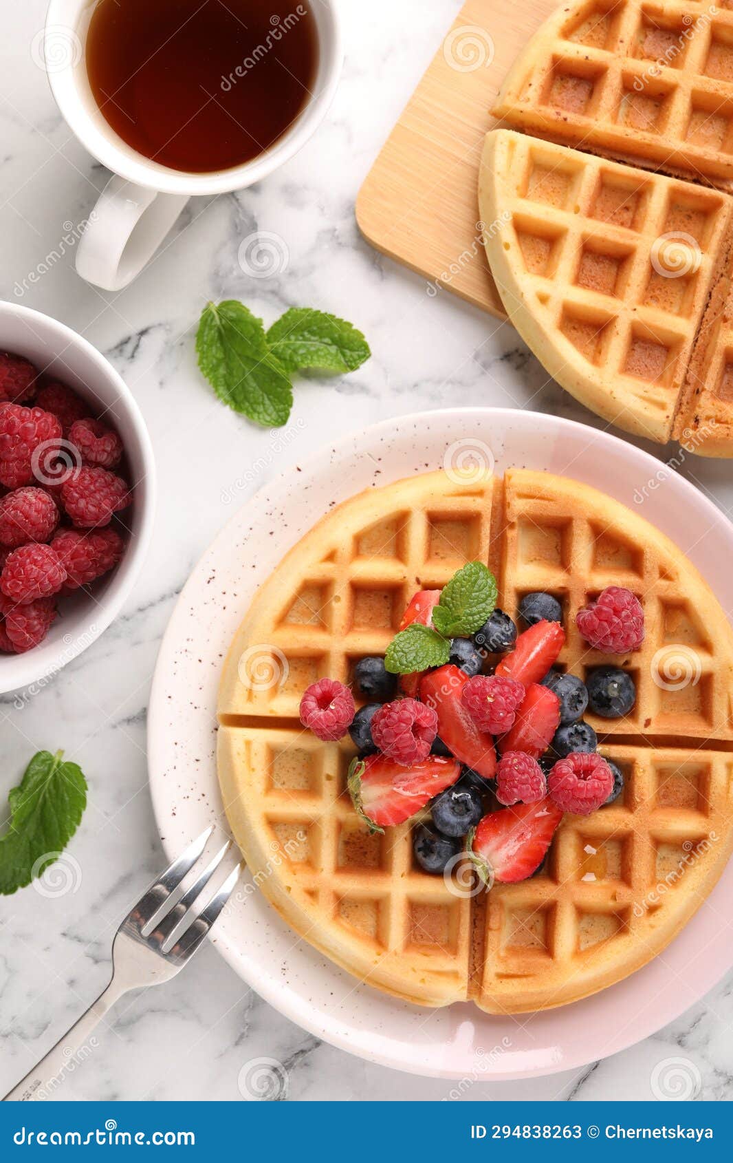 Tasty Belgian Waffles with Fresh Berries Served on White Marble Table ...