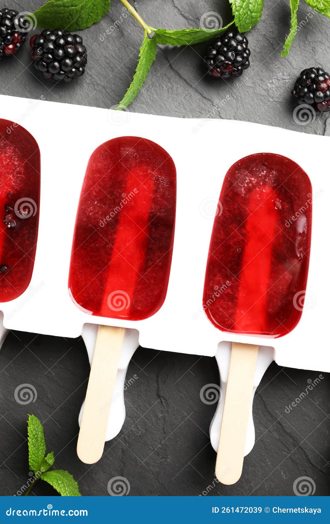 Tasty Berry Ice Pops in Mold on Grey Table, Flat Lay. Fruit Popsicle ...