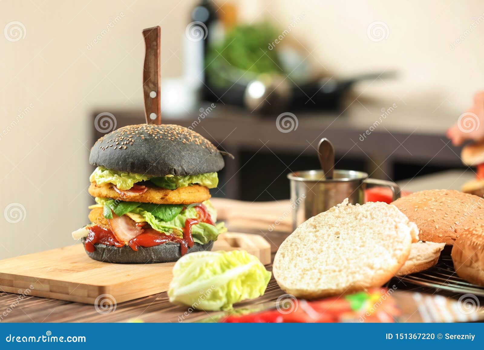 Tasty Burger and Ingredients on Kitchen Table Stock Photo - Image of ...