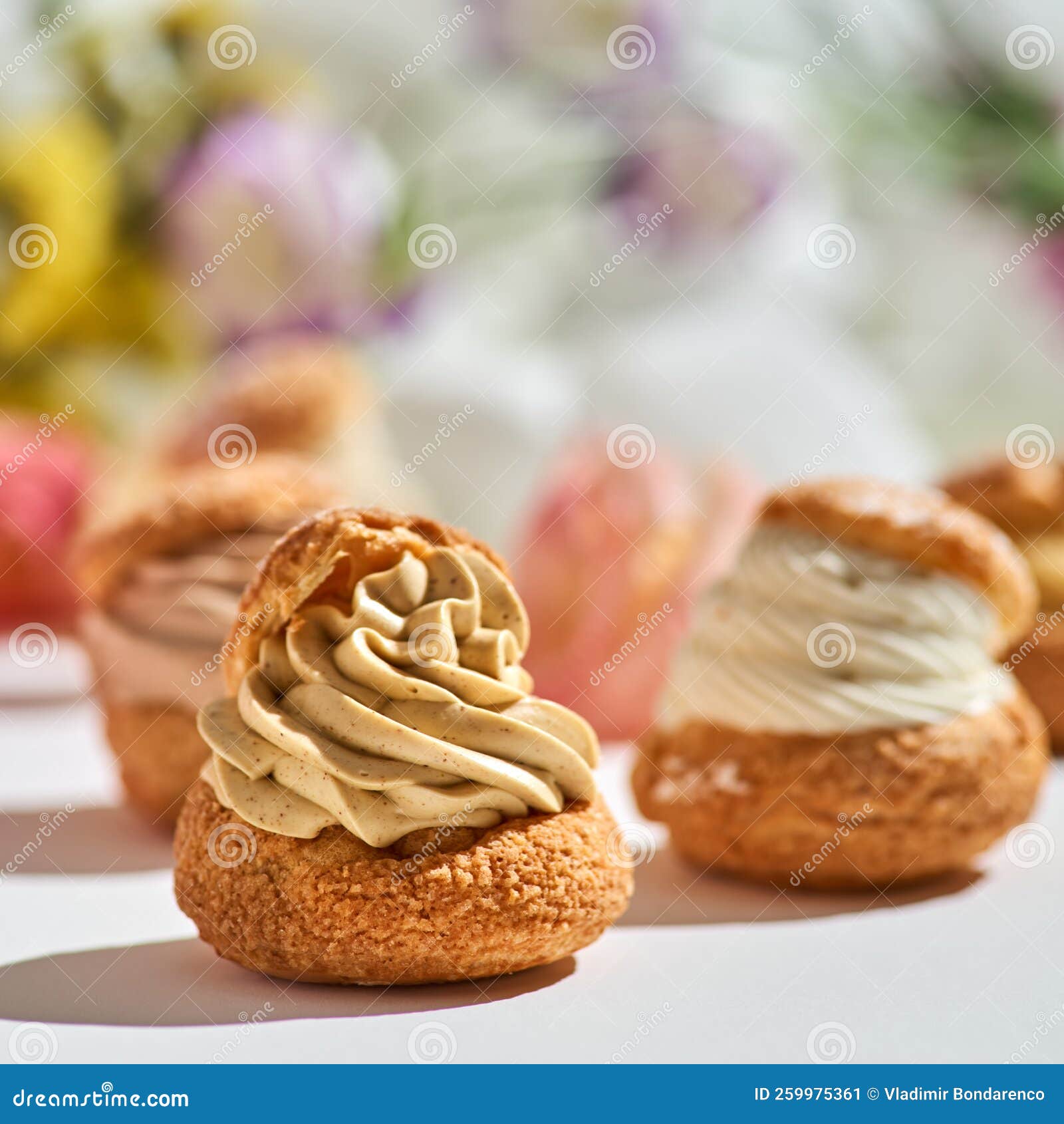 Tasty Cake Shu or Eclairs with Cream on White Background with Copy ...