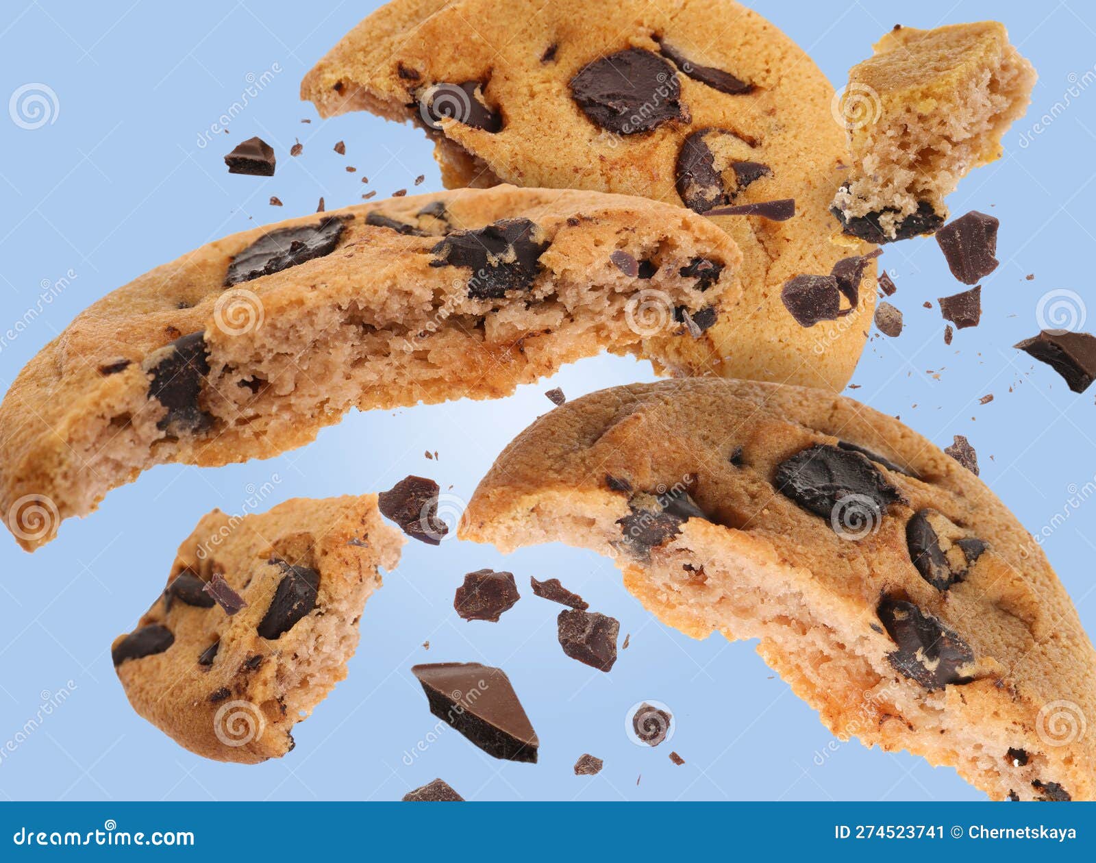 Tasty Chocolate Chip Cookies Falling on Blue Background Stock Image ...
