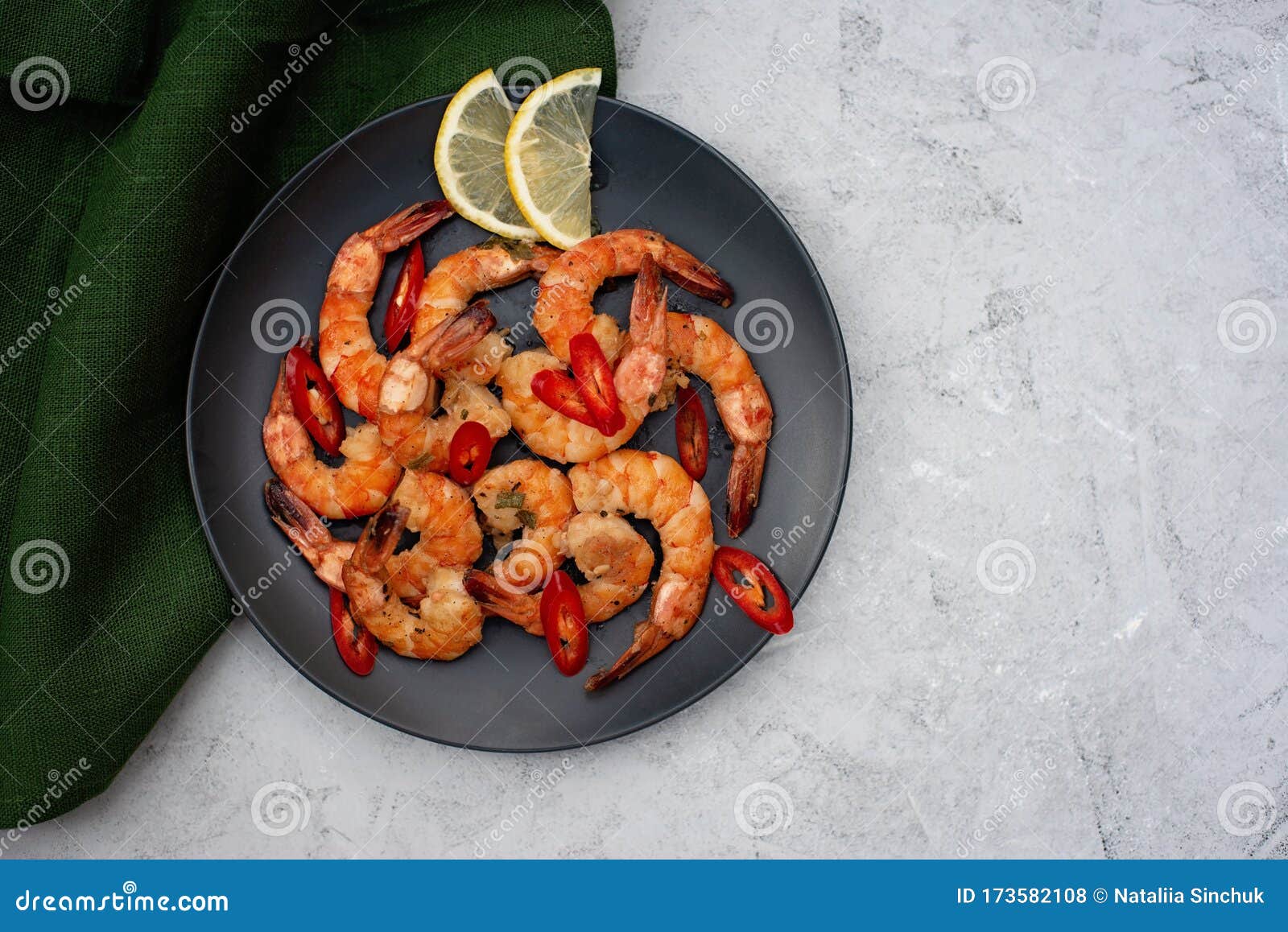 Tasty Cooked Fried Shrimp with Chilli and Lemon on a Gray Concrete ...