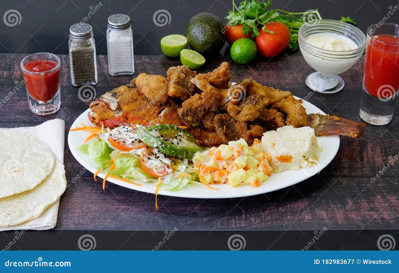 Tasty Cooked Mexican Dish with Fish with Salads and Rice Stock Image ...