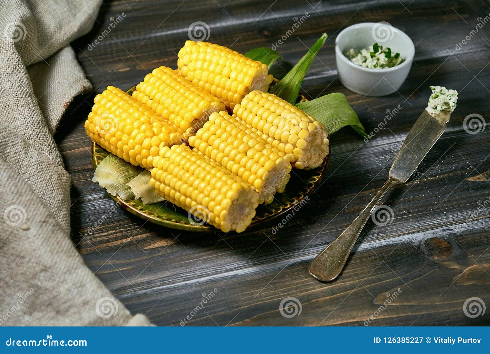 Tasty Corn Cobs on a Plate with Sauce and a Vintage Knife Stock Image ...