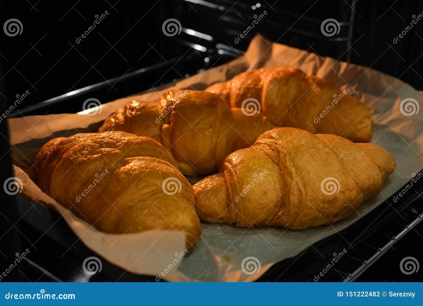 Tasty Croissants on Baking Tray in Oven Stock Photo - Image of french ...