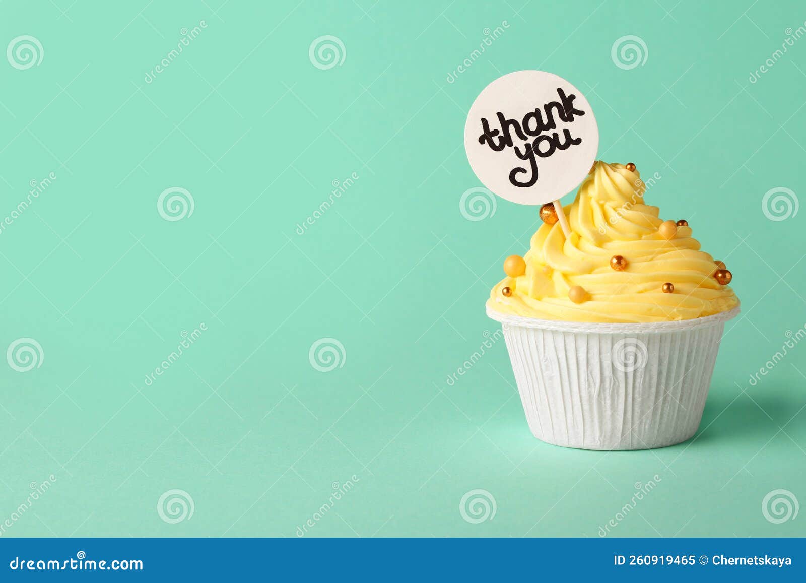 Tasty Cupcake and Note with Phrase Thank You on Turquoise Background ...