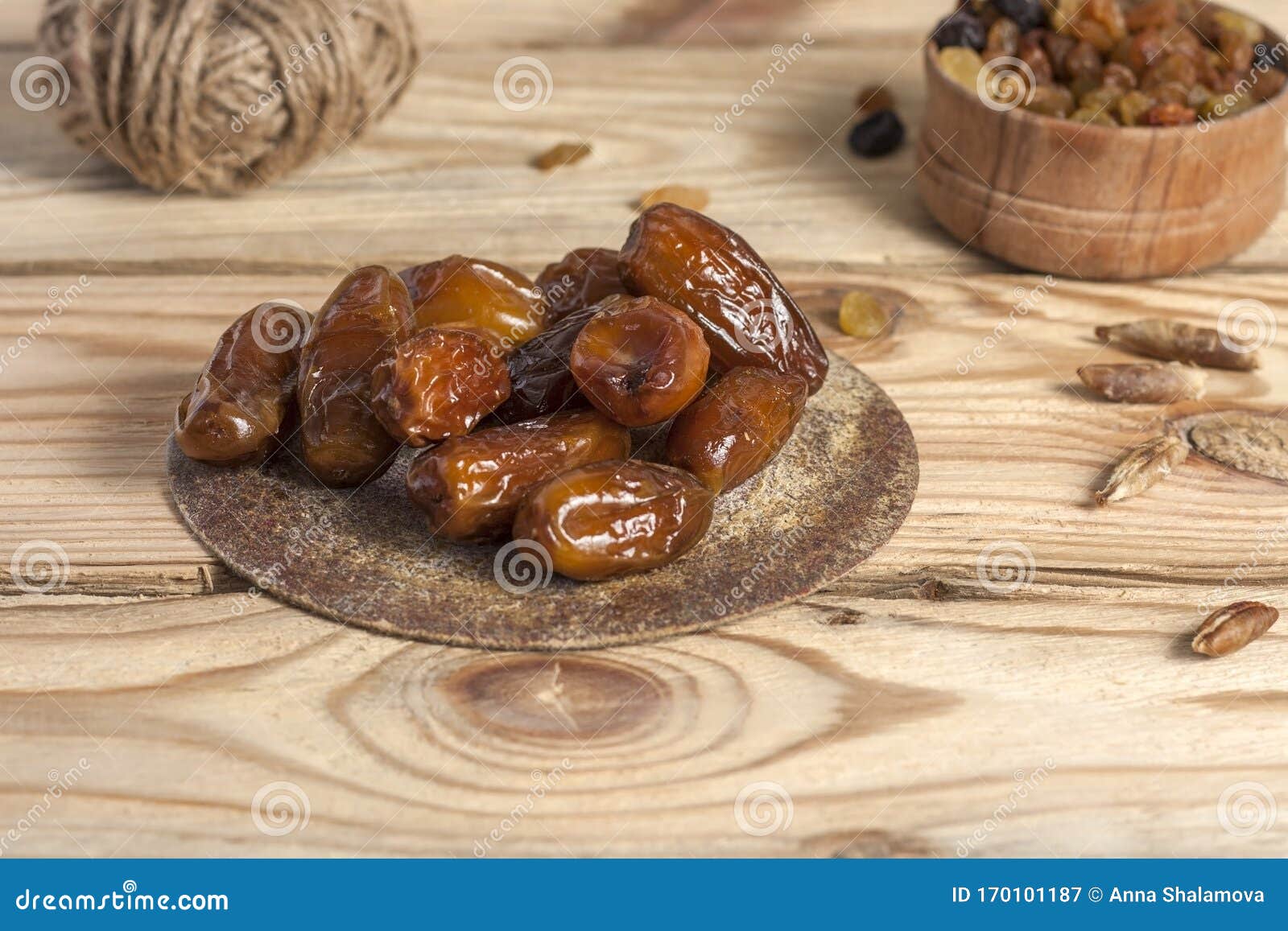 Tasty Dates on a Round Substrate Close-up on a Wooden Background Stock ...