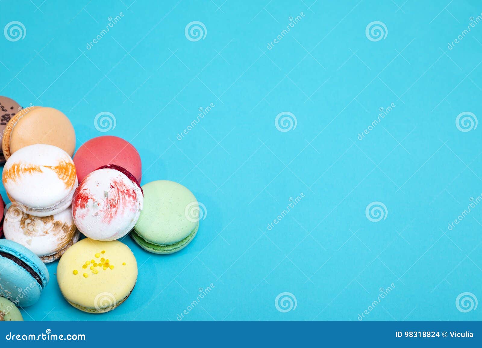 Tasty Different Colored Macarons on Blue Backgroundn Stock Photo ...
