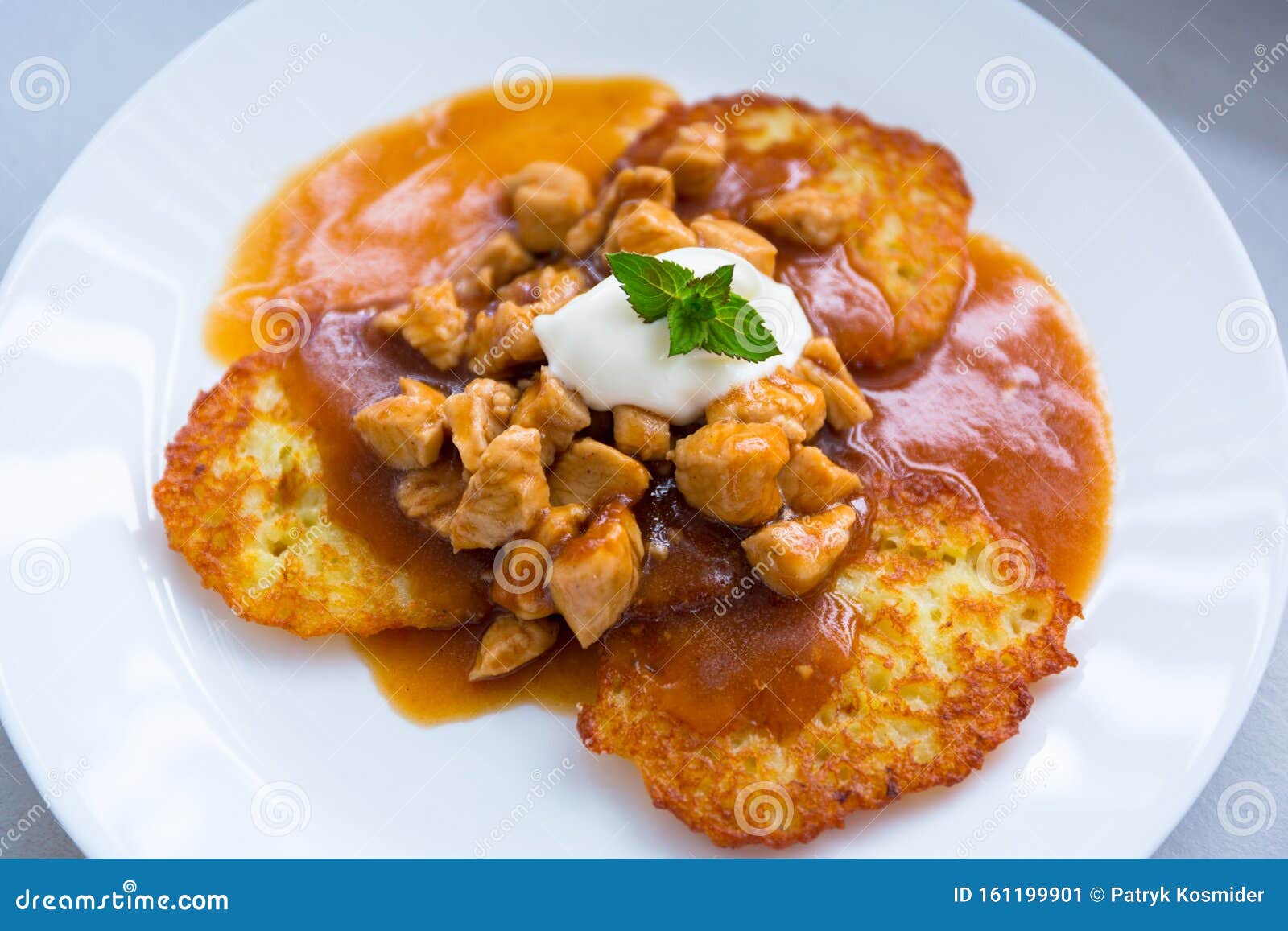 Tasty Dinner on a Plate of Hash Browns with Sauce and Chicken Stock ...