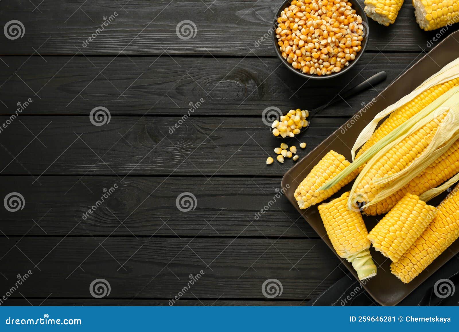 Tasty Fresh Corn Cobs and Kernels on Black Wooden Table, Flat Lay ...