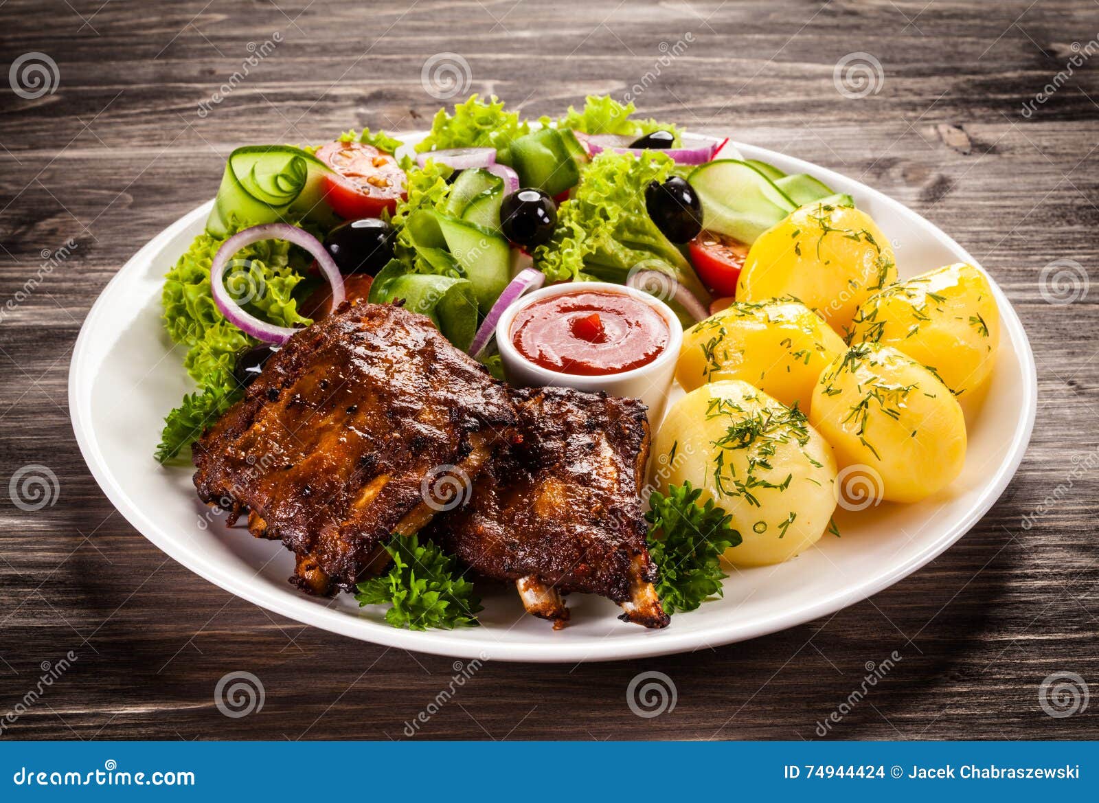 Tasty grilled ribs stock photo. Image of dinner, garnish - 74944424