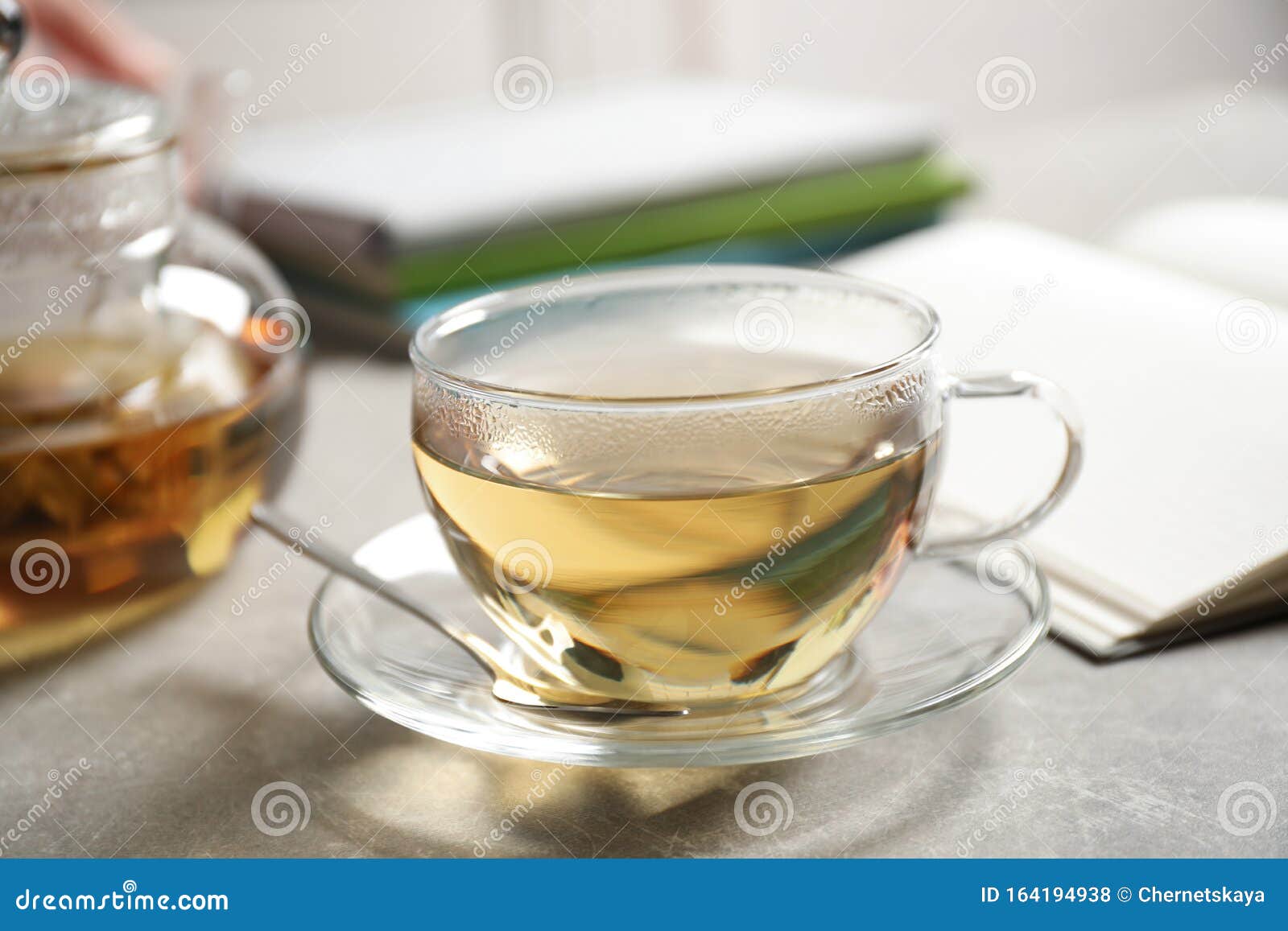 Tasty Hot Green Tea in Cup on Grey Table, Closeup Stock Photo - Image ...