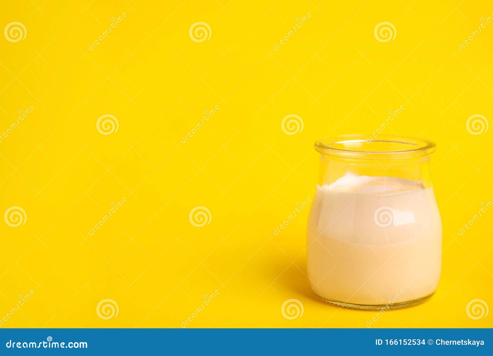 Tasty Organic Yogurt on Yellow. Space for Text Stock Photo - Image of ...