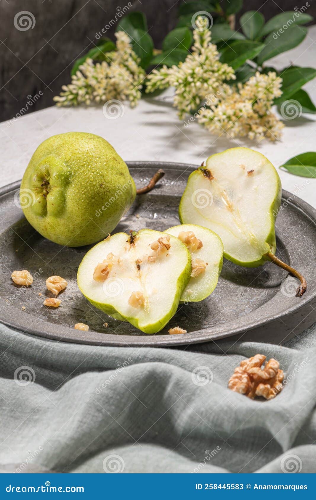 Tasty Pears with Nuts. a Table Decorated with Flowers and a Plate of ...