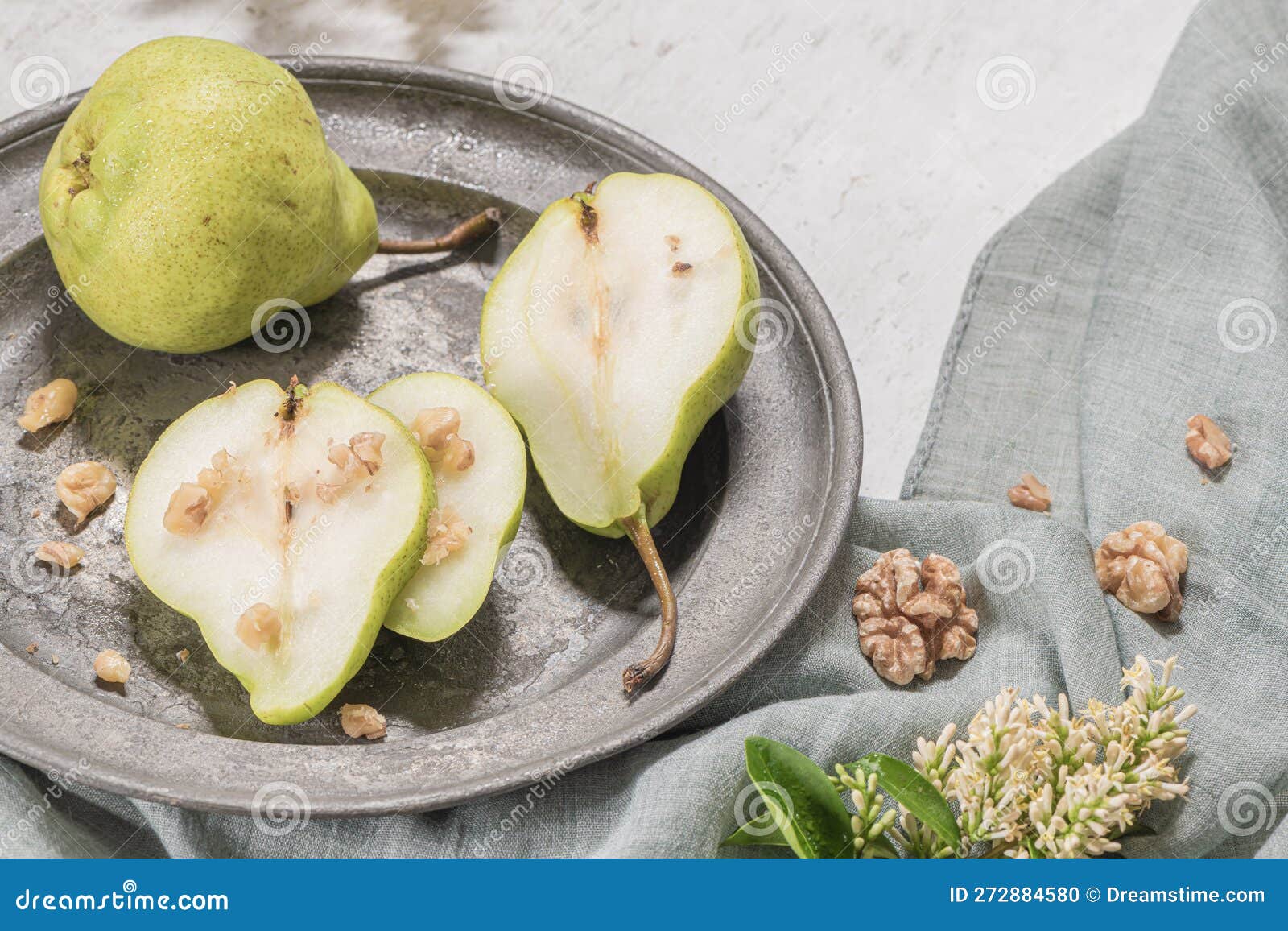 Tasty Pears with Nuts. a Table Decorated with Flowers and a Plate of ...