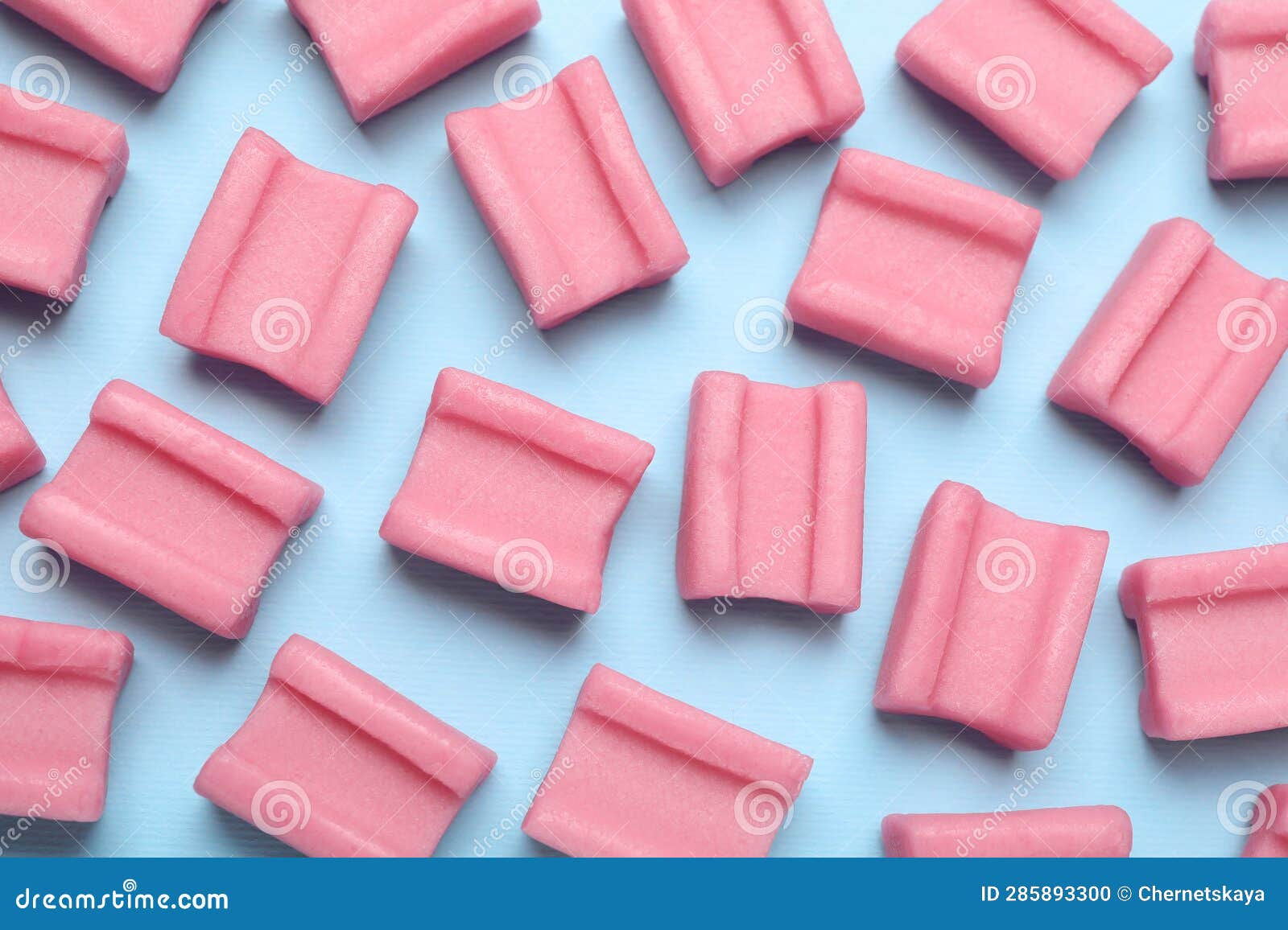 Tasty Pink Chewing Gums on Light Blue Background, Flat Lay Stock Photo ...