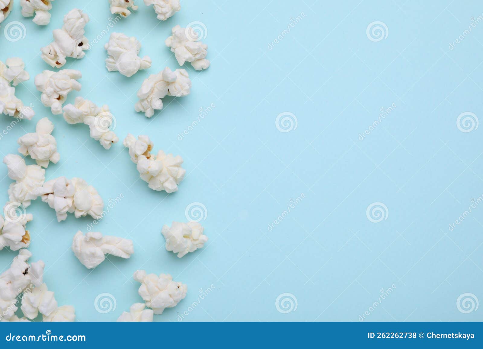Tasty Popcorn on Light Blue Background, Flat Lay. Space for Text Stock ...