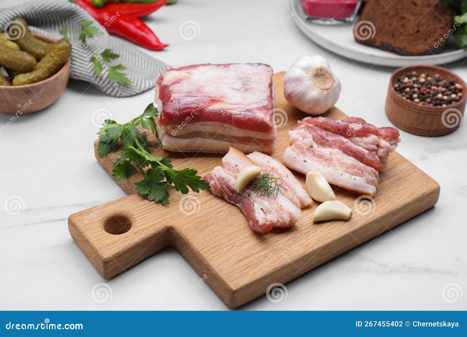 Tasty Pork Fatback with Garlic and Herbs on White Marble Table Stock ...