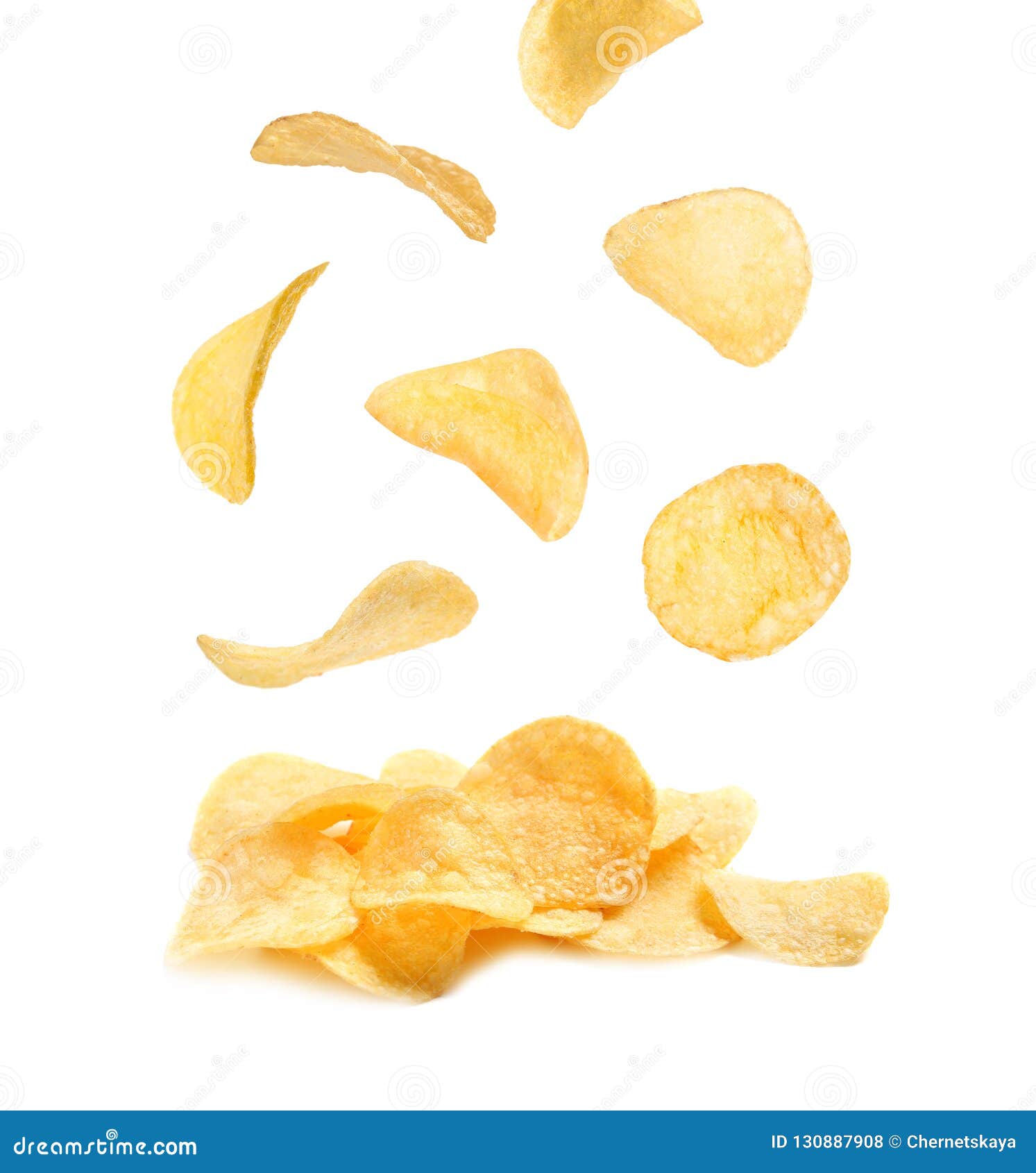 Tasty potato chips falling stock photo. Image of creative - 130887908