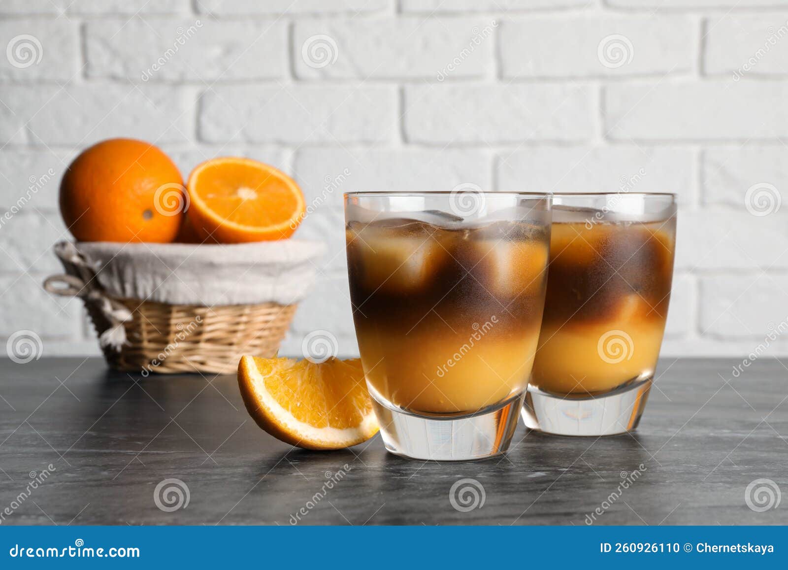 Tasty Refreshing Drink with Coffee and Orange Juice on Grey Marble ...
