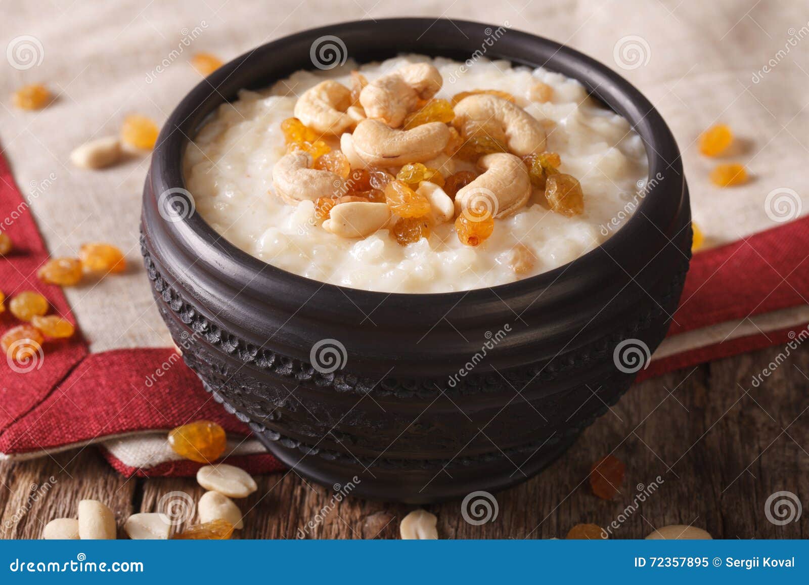 Tasty Rice Pudding with Nuts and Raisins in a Bowl Close-up. Horizontal ...