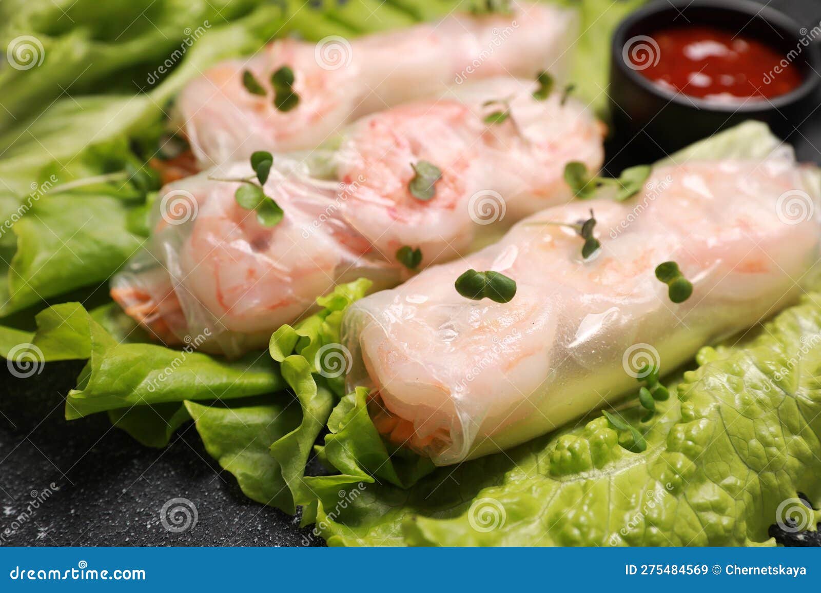 Tasty Spring Rolls Served with Lettuce and Microgreens on Grey Textured ...