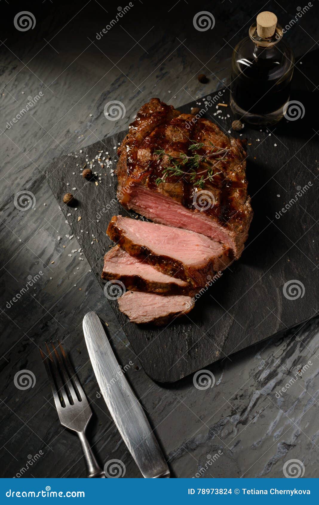 Tasty Stake Against a Black Background Stock Photo - Image of board ...