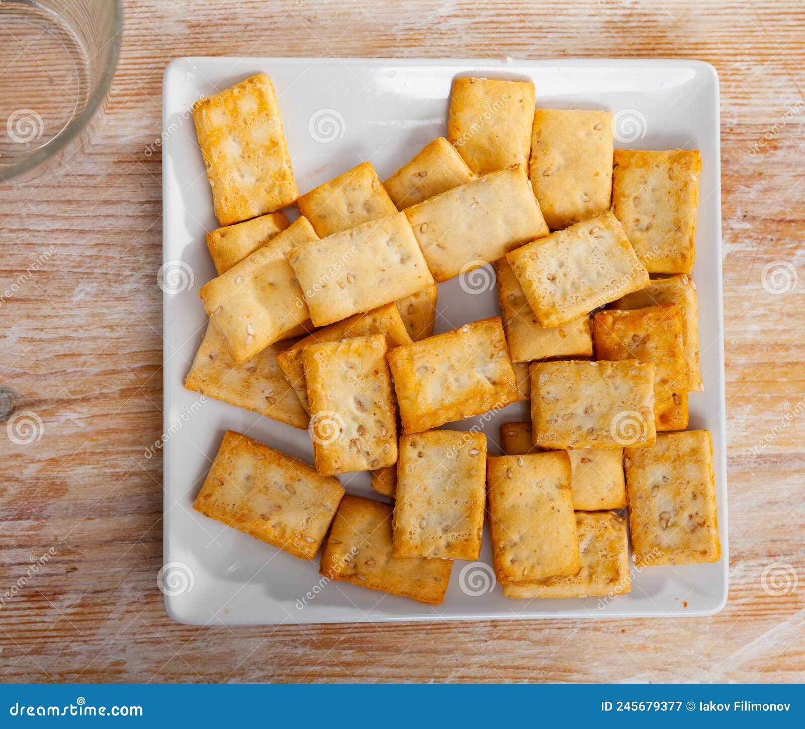 Thin Crackers with Sesame Seeds on Plate Stock Image - Image of pastry ...