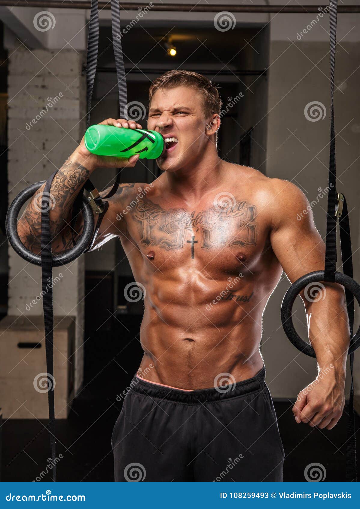 Tattoed Bodybuilder on a Rest Stock Image - Image of drink, attractive ...
