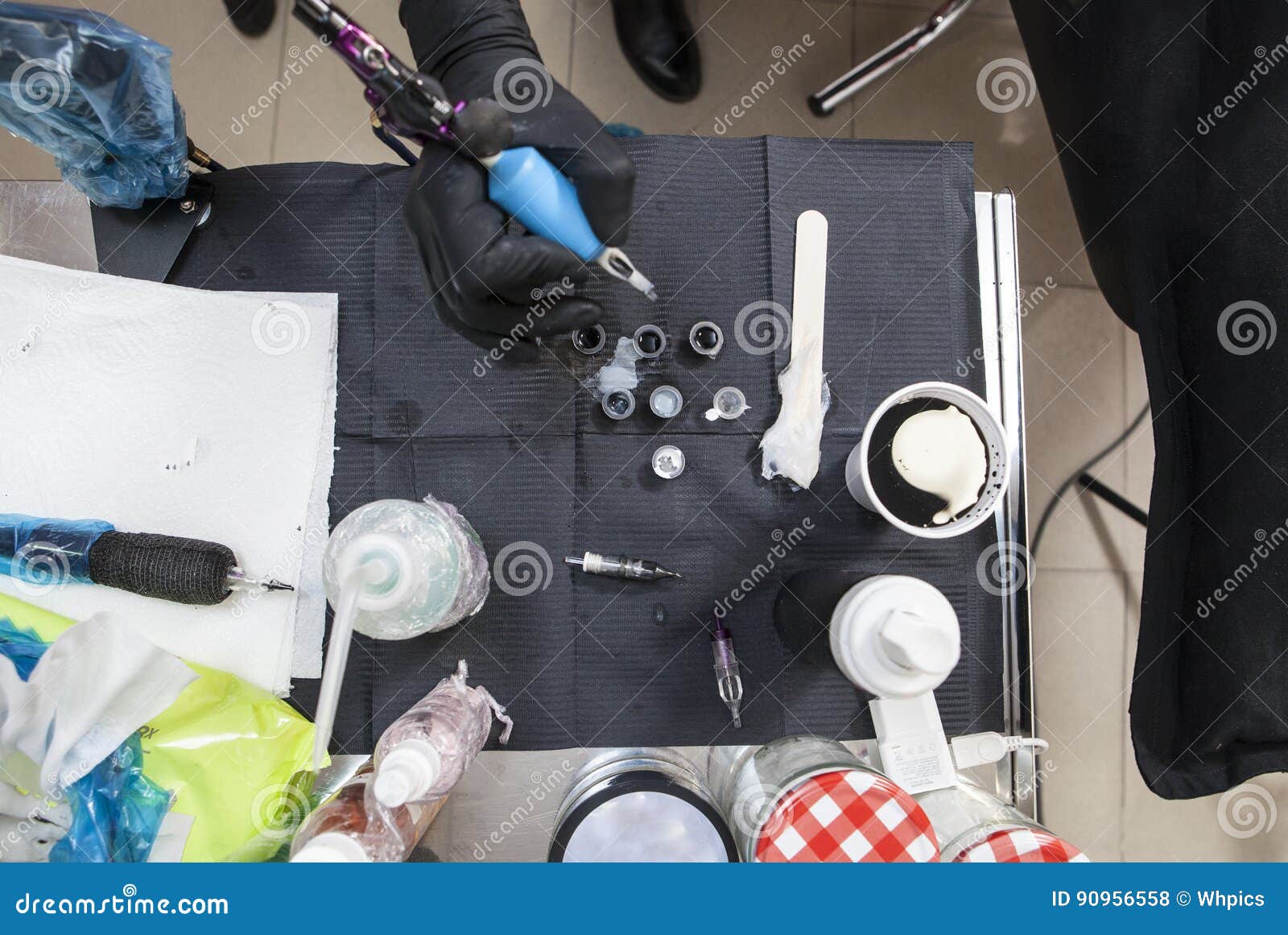 Tattoo Artist Table while she is Refilling the Machine Stock Photo ...