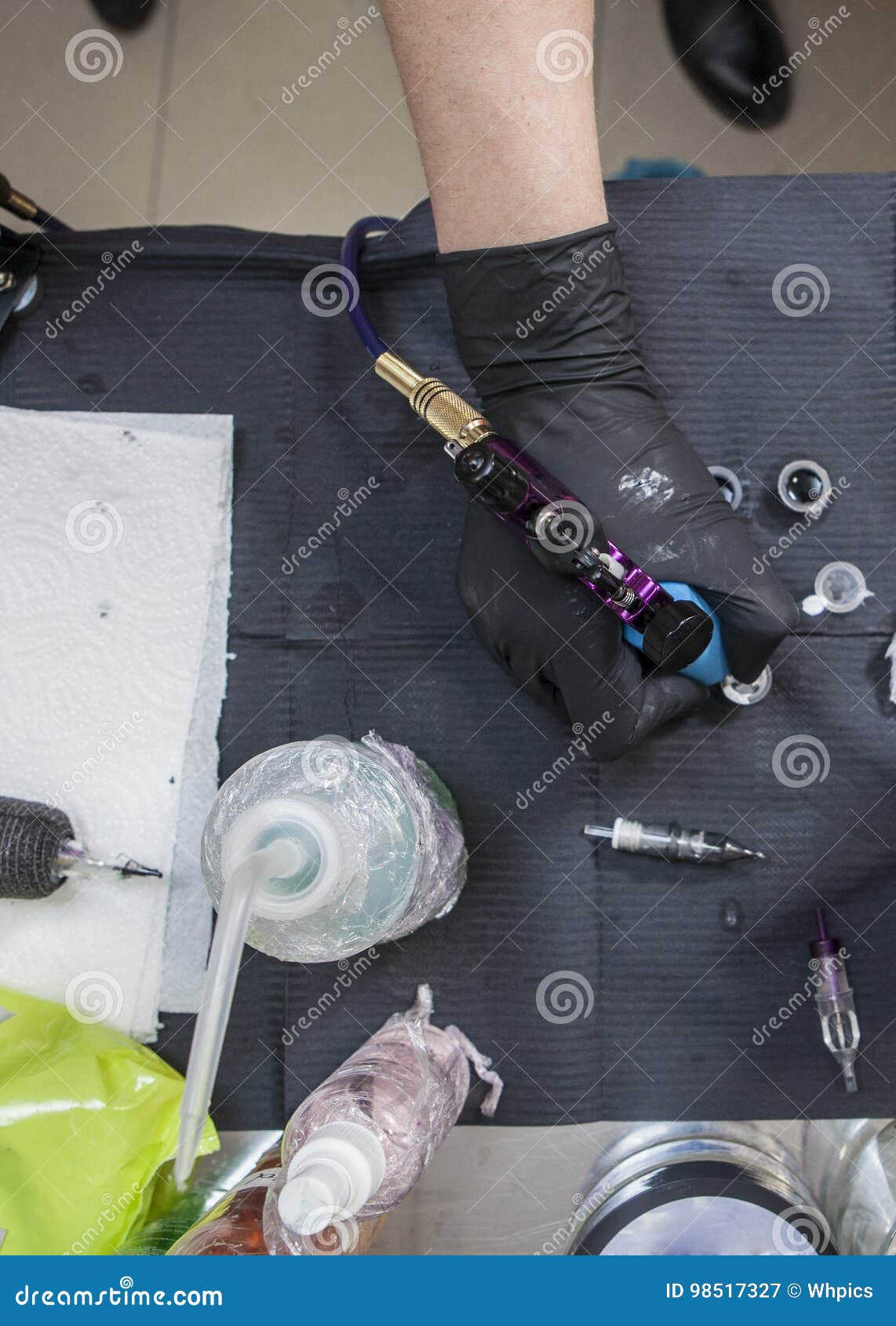 Tattoo Artist Table while she is Refilling the Machine Stock Image ...