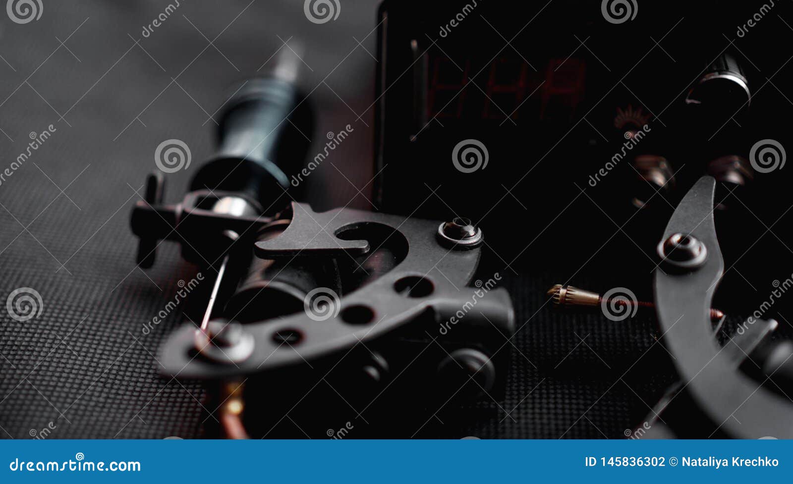 Tattoo Machine and Tattoo Supplies on Dark Background Stock Photo ...