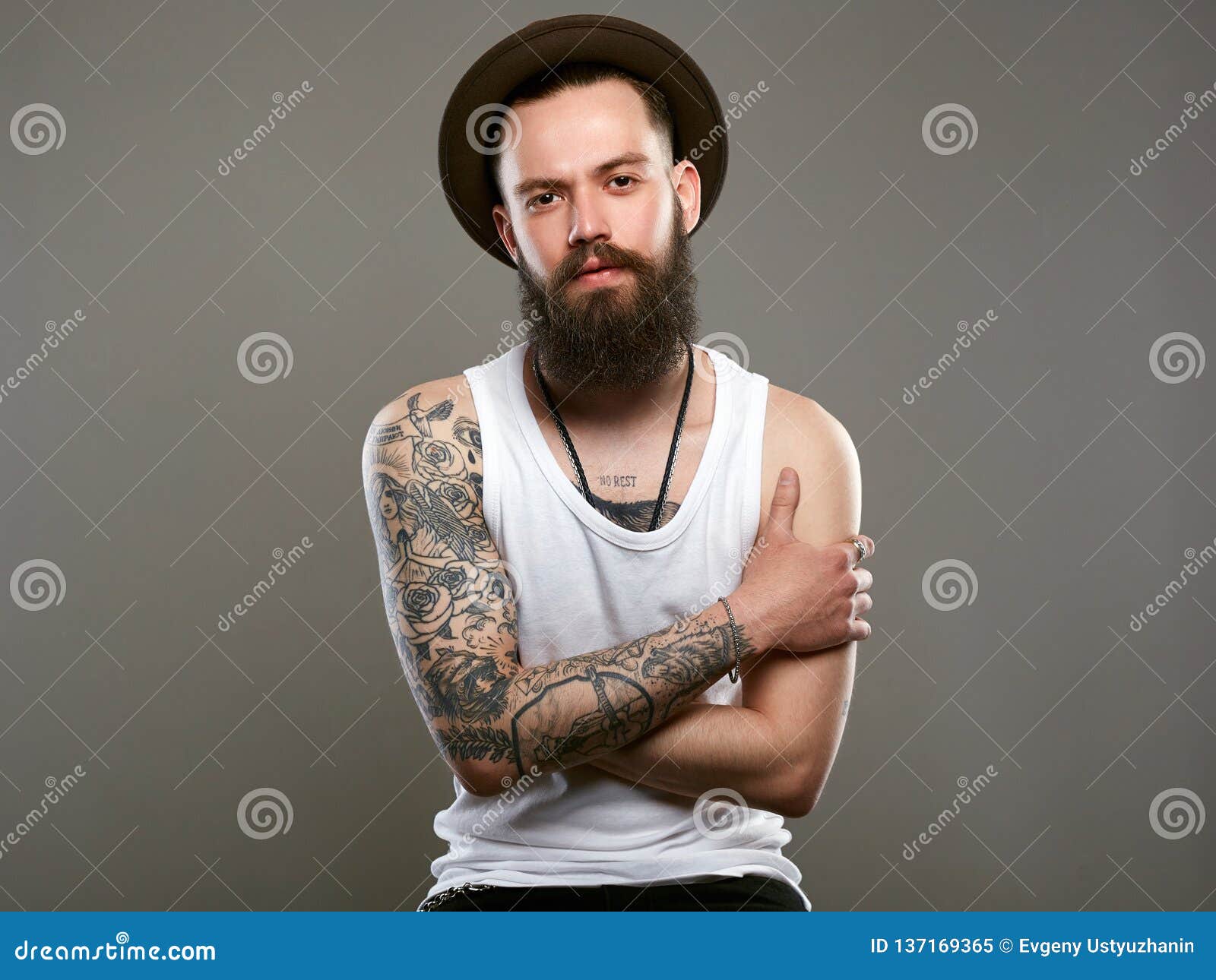 Tattooed Handsome Bearded Man in Hat Stock Image - Image of closeup ... Tattooed Handsome Bearded Man in Hat Stock Image - Image of closeup ...