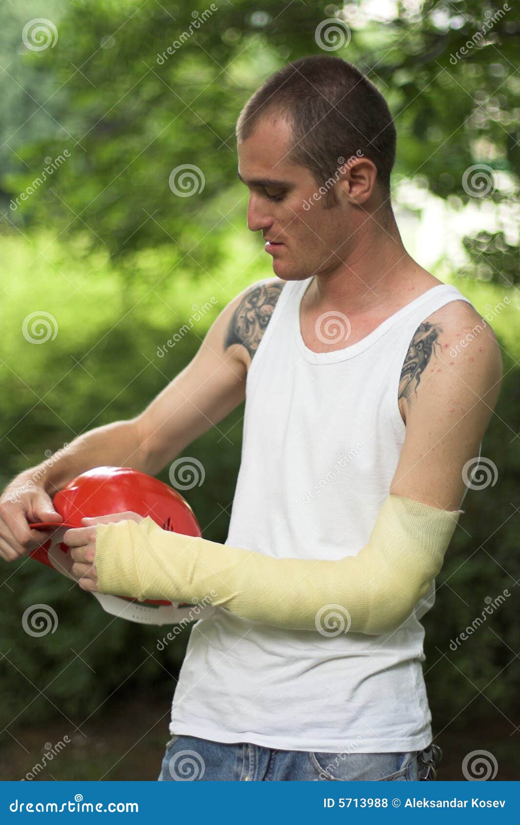 Tattooed man in plaster stock photo. Image of bandage - 5713988