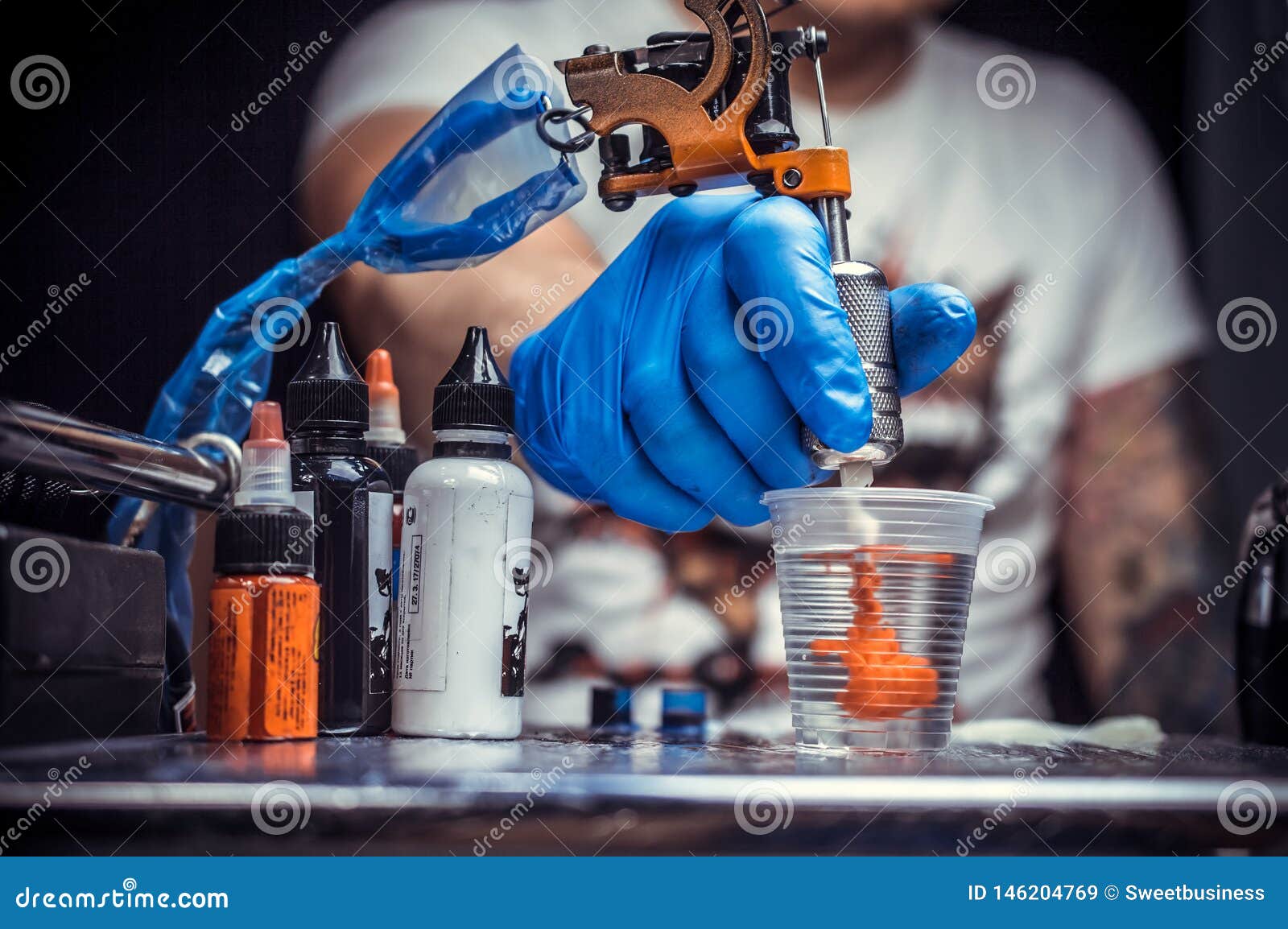 Hand of a Tattooer, Holding a Tattoo Device. Stock Image - Image of ...
