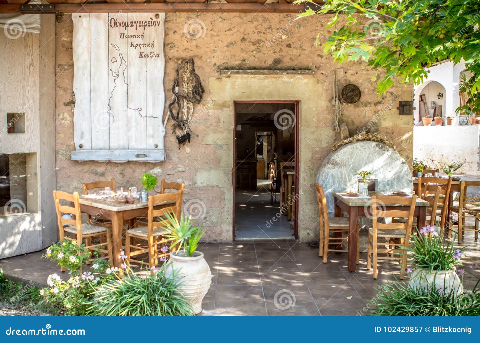 Greek taverna stock image. Image of sunny, sign, cafe - 102429857